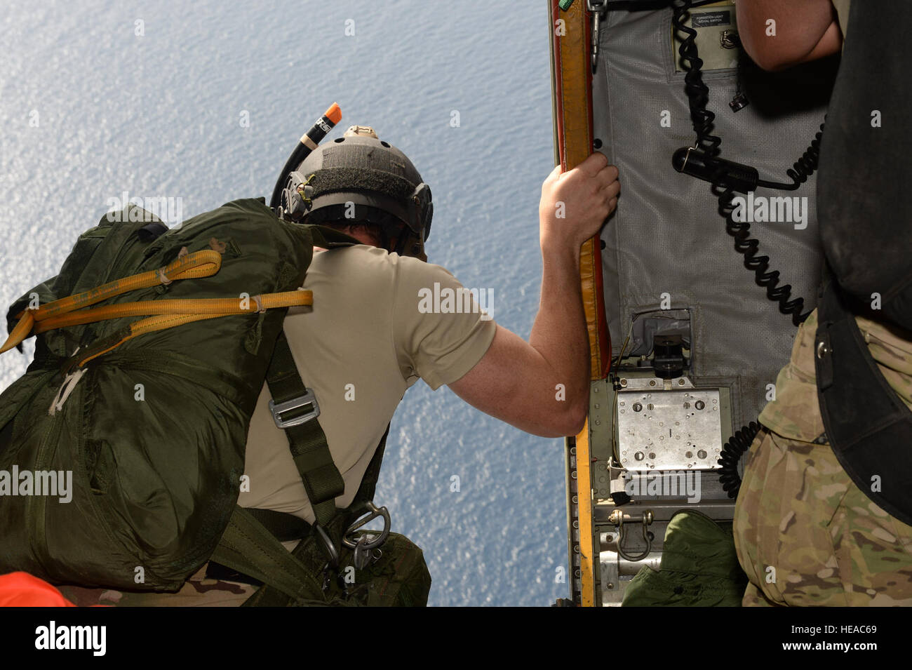 A pararescueman from the 82nd Expeditionary Rescue Squadron looks over ...