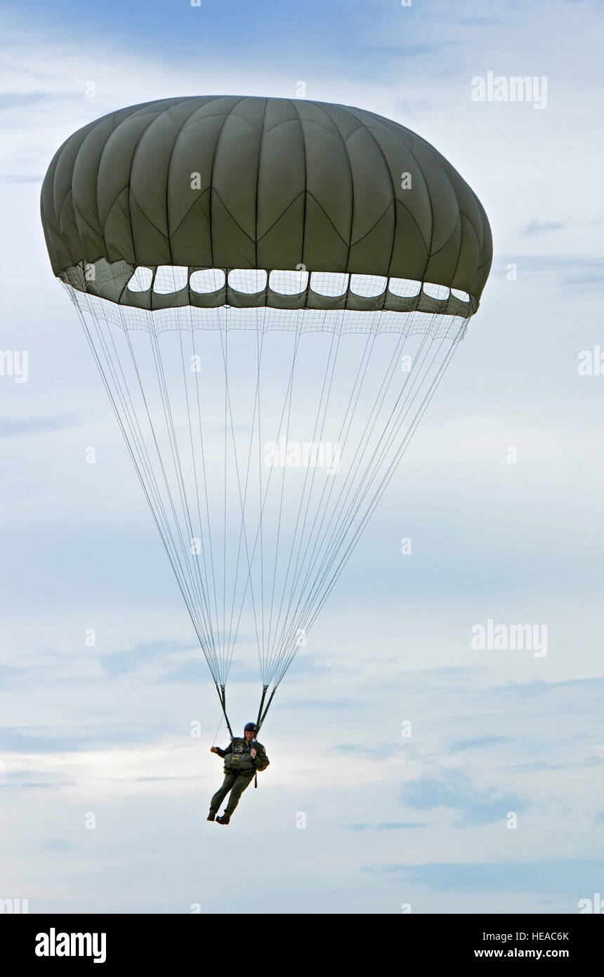 Air Force personnel perform static line parachute training from a C-130 ...