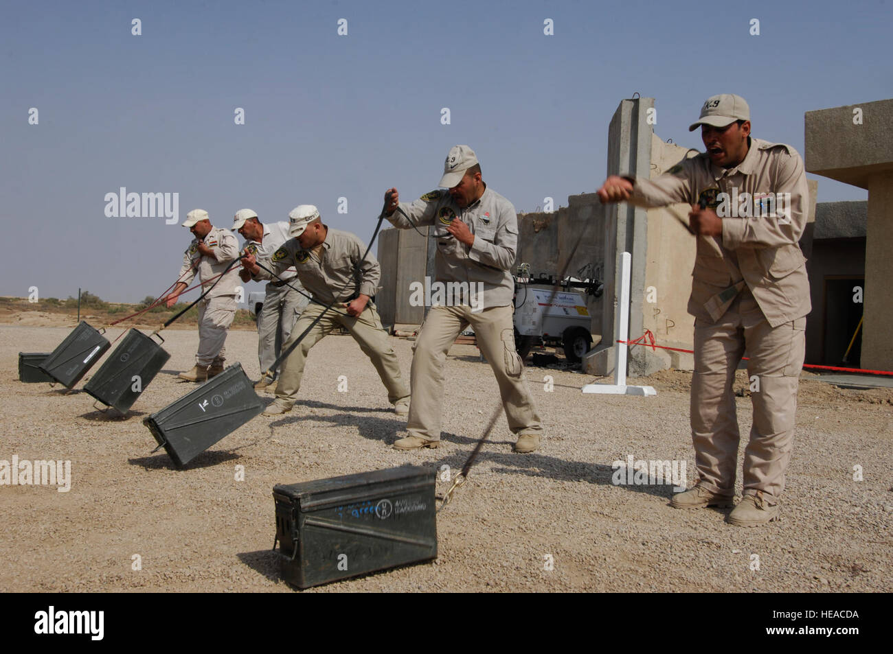 Iraqi police demonstrates how to properly give commands by simulating ...