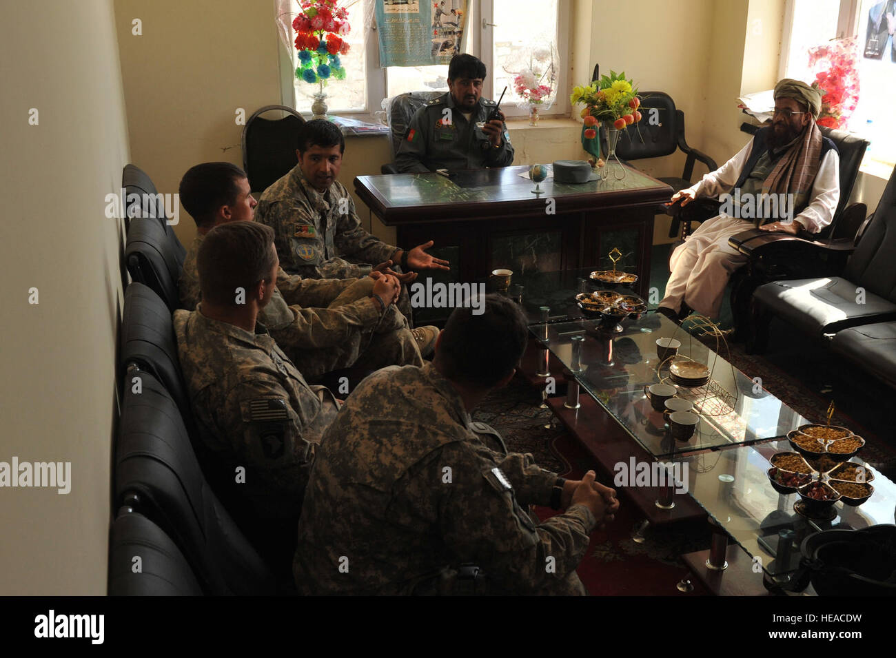 Members of the 101st Airborne Division meet with a village elders and ...