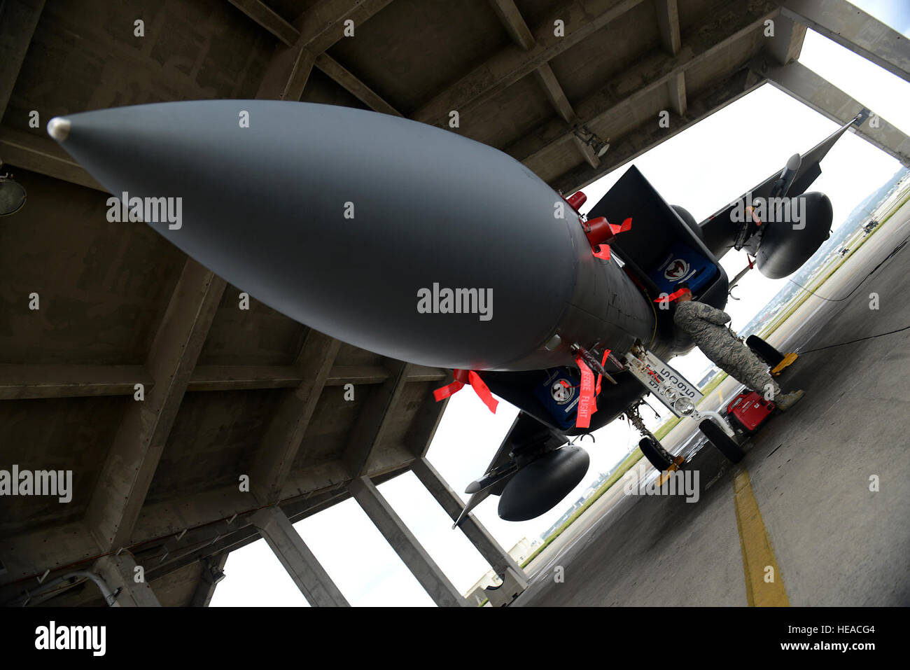 An U.S. Air Force wing inspection team member installs a smoke machine ...