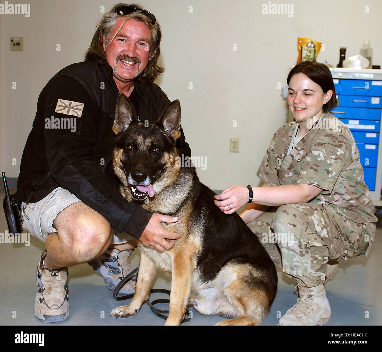 Contract working dog Tommi and his handler, Simon Williams (left ...