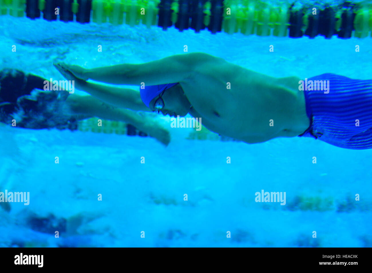 Retired U.S. Air Force Senior Airman Lucky Lor competes in the swimming ...