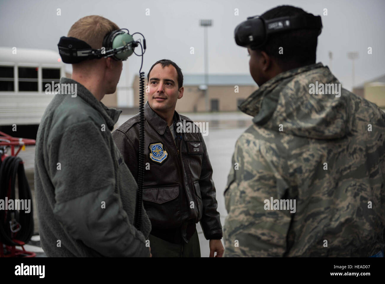 Capt. Chad Halverstadt, 93rd Air Refueling Squadron pilot, leads an inspection of a KC-135R ...