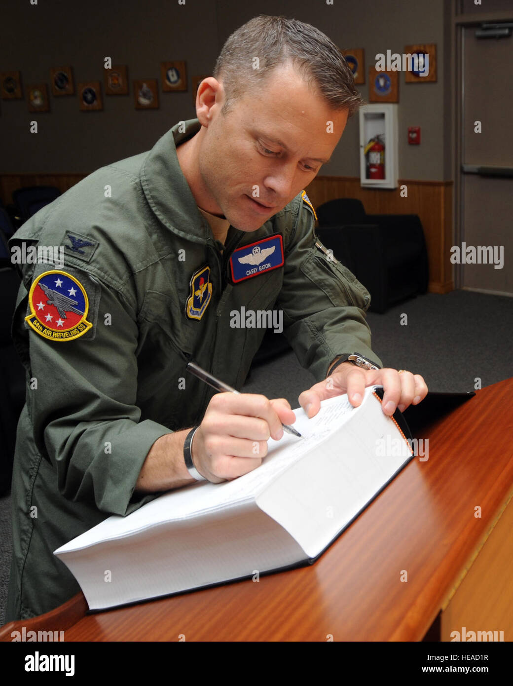 Col. Casey Eaton, 97th Air Mobility Wing vice commander, signs the KC ...