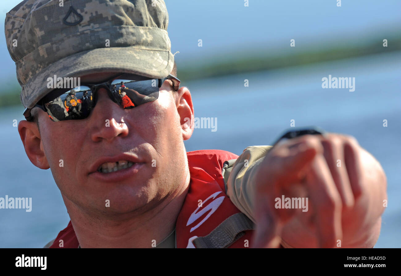 Pfc. Robert Lenigan of Star, Idaho, points to a paratrooper in the ...