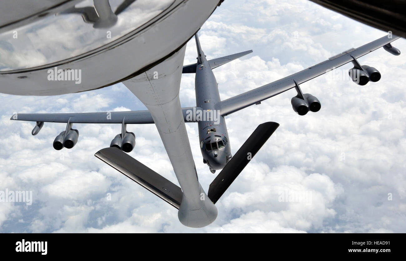 A B-52 Stratofortress approaches the refueling boom of a KC-135 ...