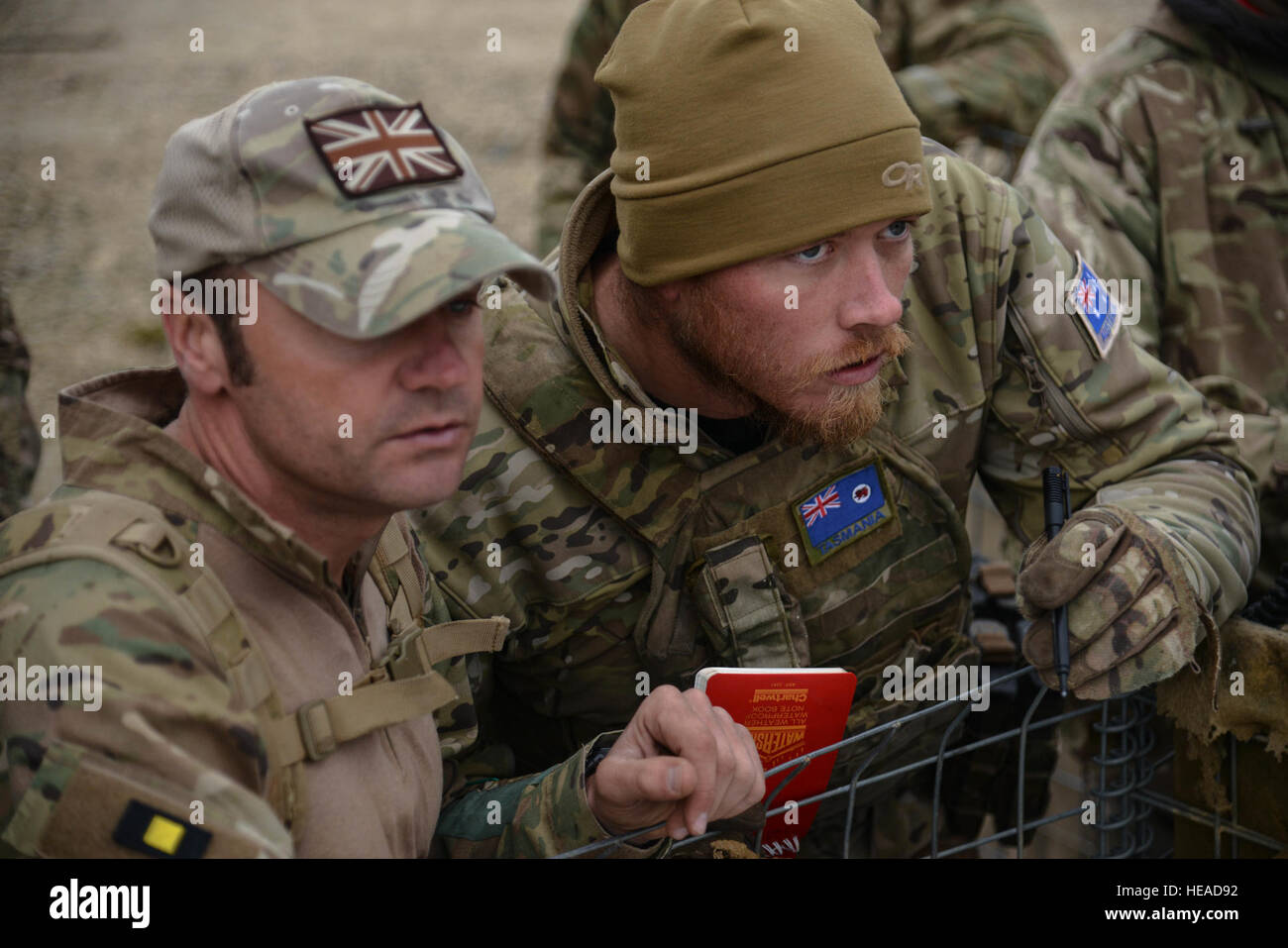 Two British soldiers plot grid coordinates as part of the Call for Fire ...