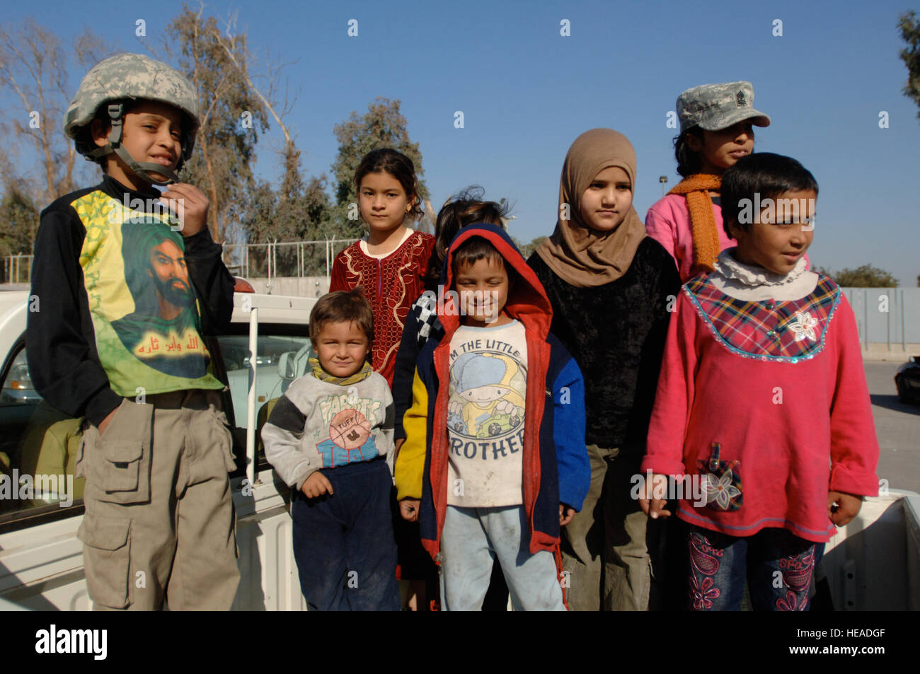 A group of Iraqi children from a Baghdad orphanage wait for a donation ...