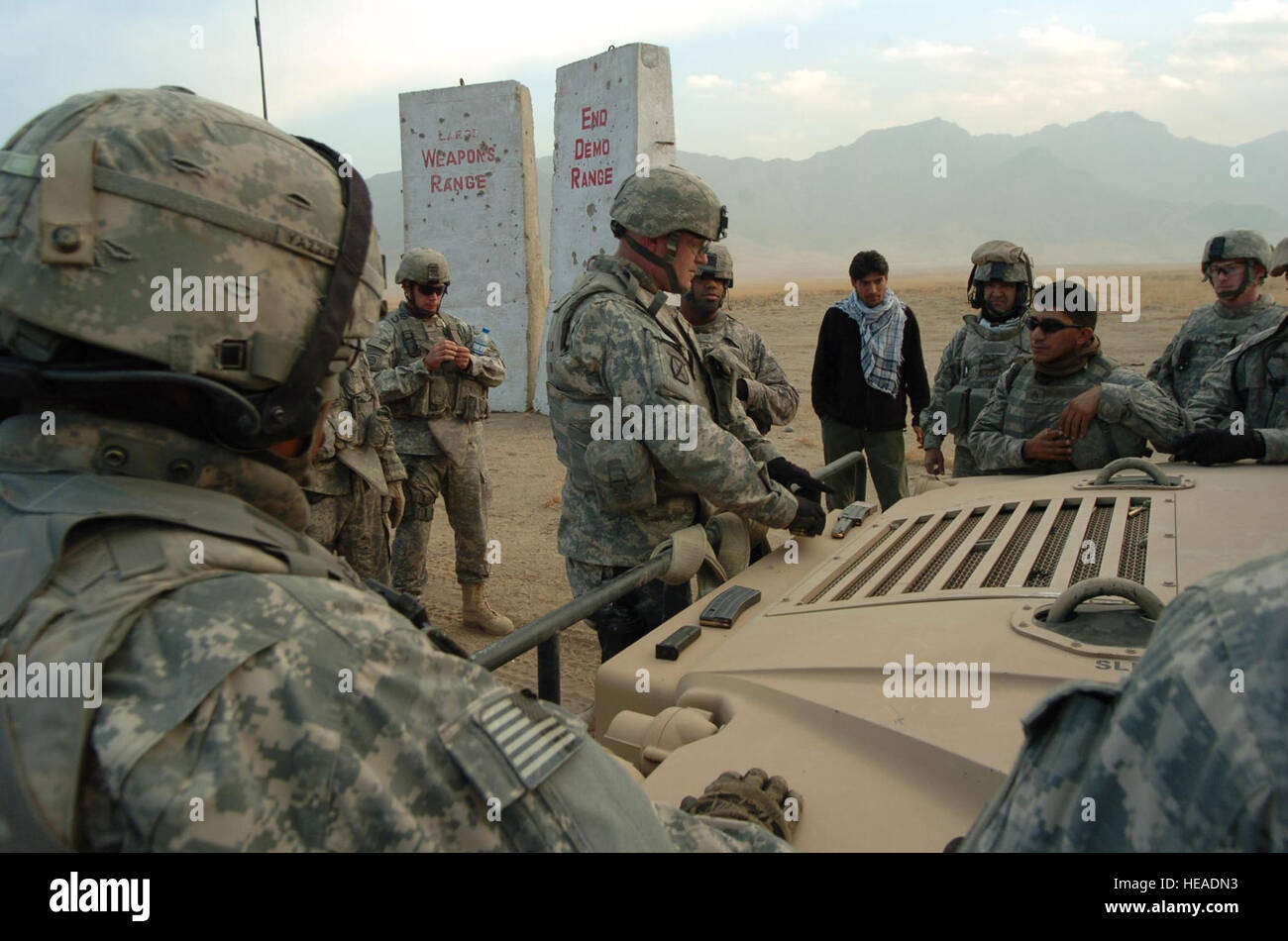 BAGRAM AIRFIELD, AFGHANISTAN -- Army Maj. Jeremy McGuire, Kohe Safi ...