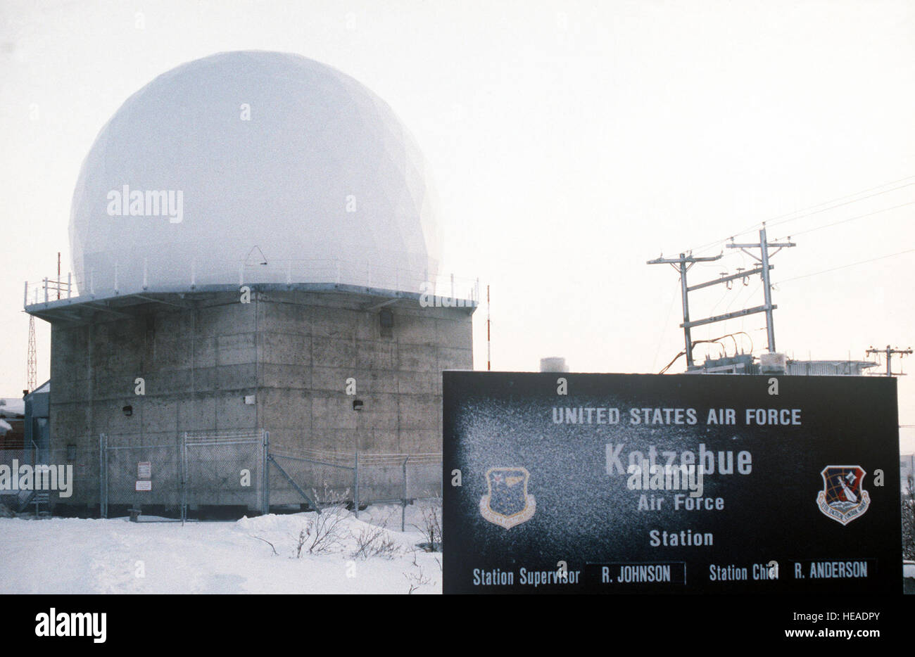 A view of the sign at the entrance to the station and the long-range ...