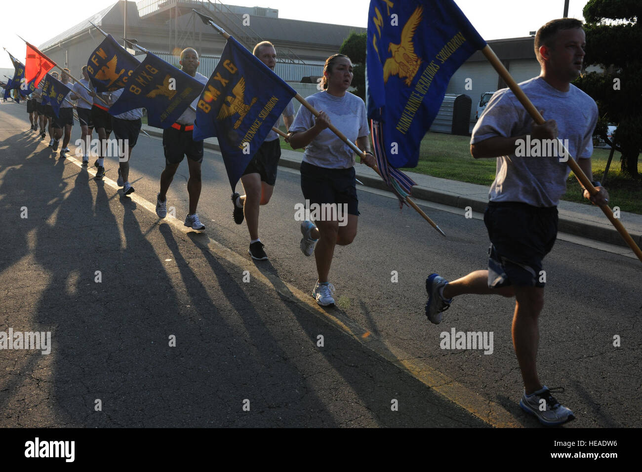 First sergeants from the 8th Fighter Wing run with their squadron flags ...