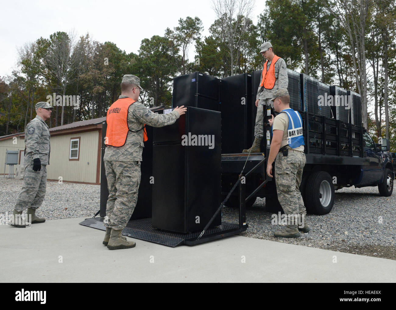 U.S. Air Force Airmen from the 633rd Air Base Wing unload refrigerators ...