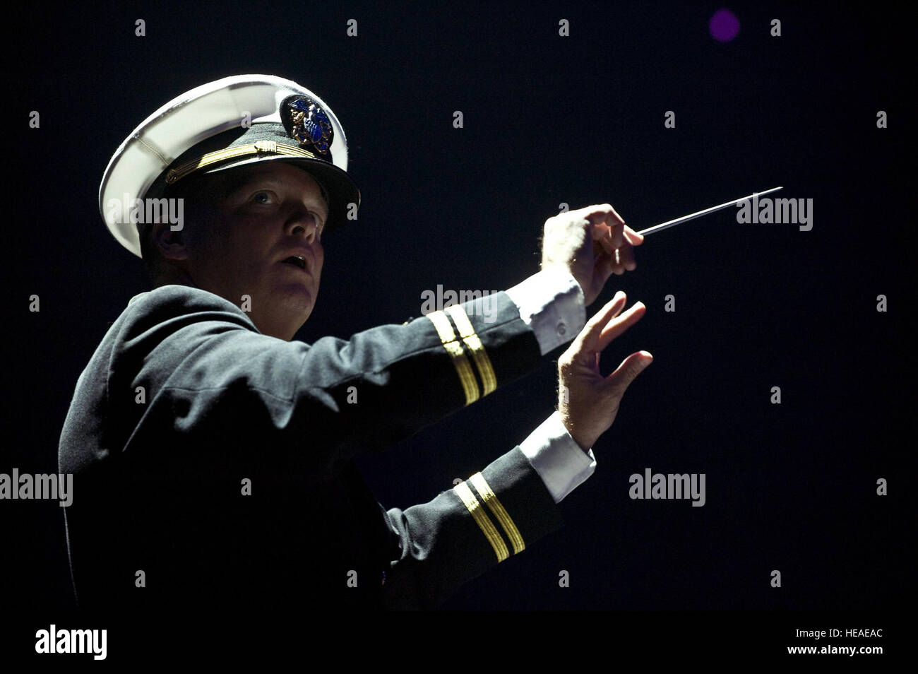 A U.S. Navy conductor directs the US Navy Band Southwest during the ...