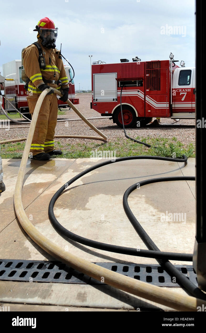 A firefighter from the 97th Civil Engineer Squadron fire department ...