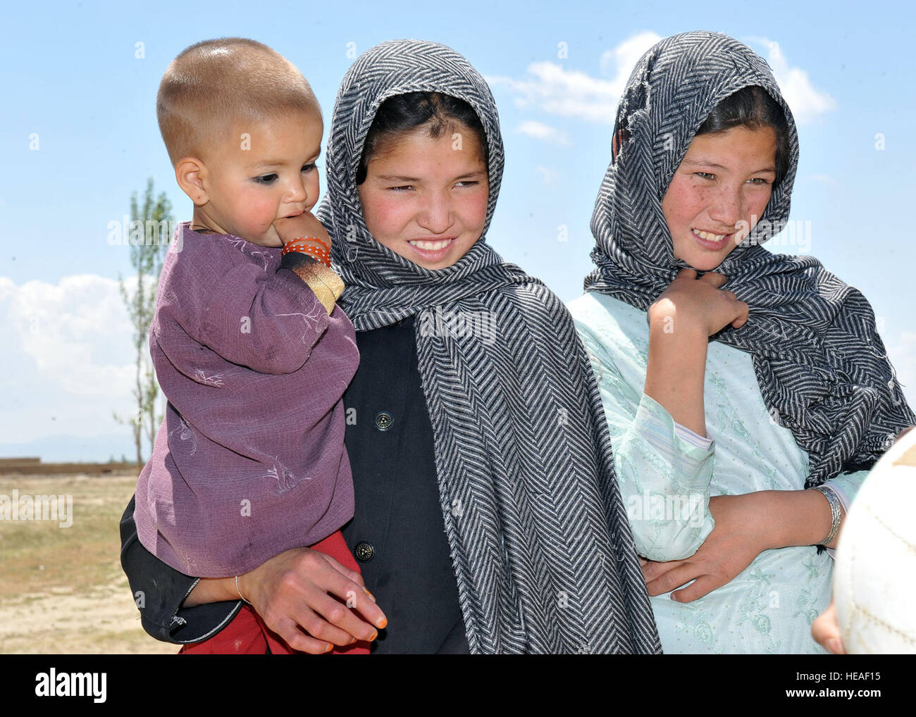 GHAZNI PROVINCE, Afghanistan - Three Afghan girls look on during a ...