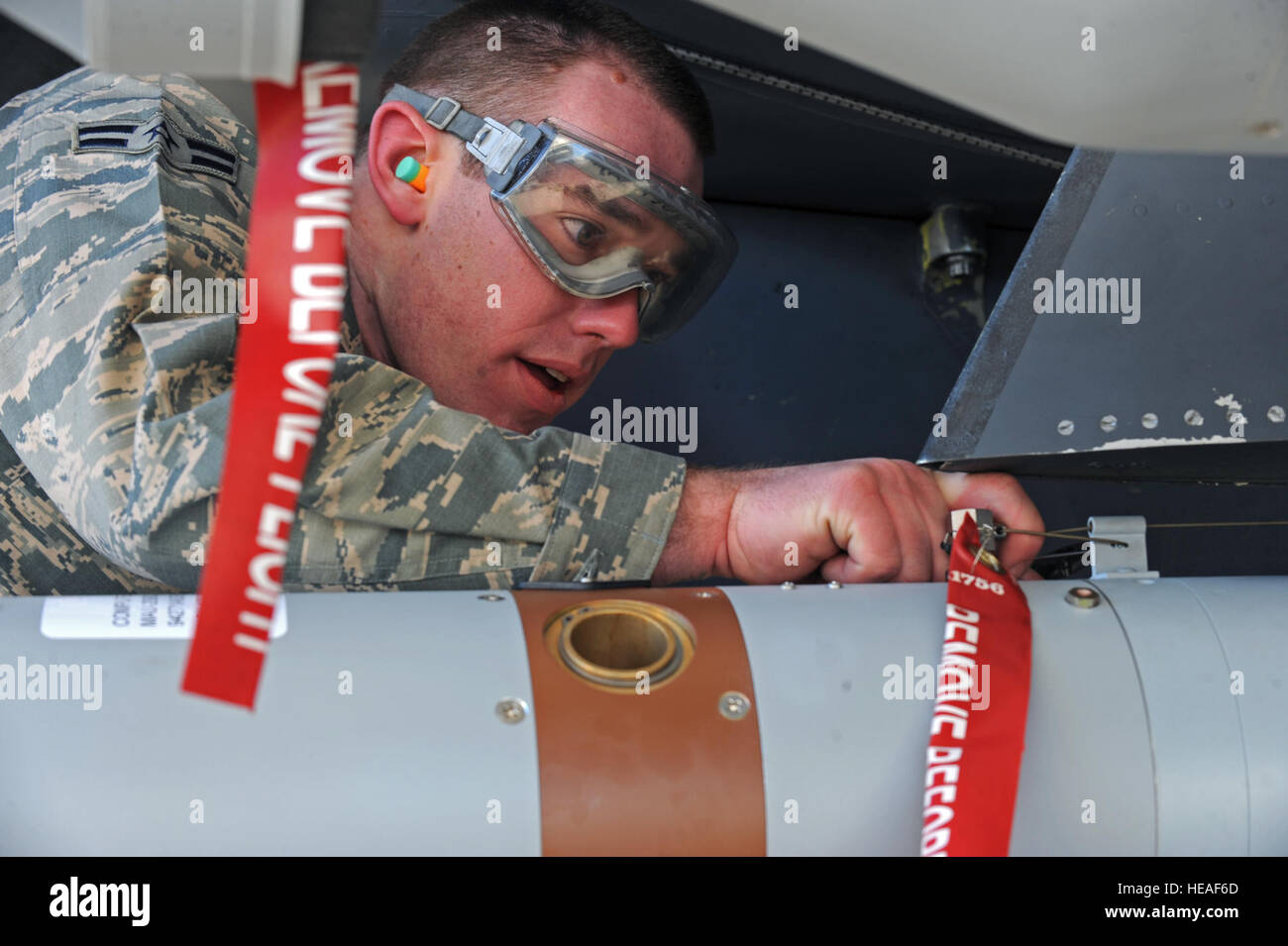 Airman 1st Class wires the Battery Firing Device on a GBU-12 laser ...