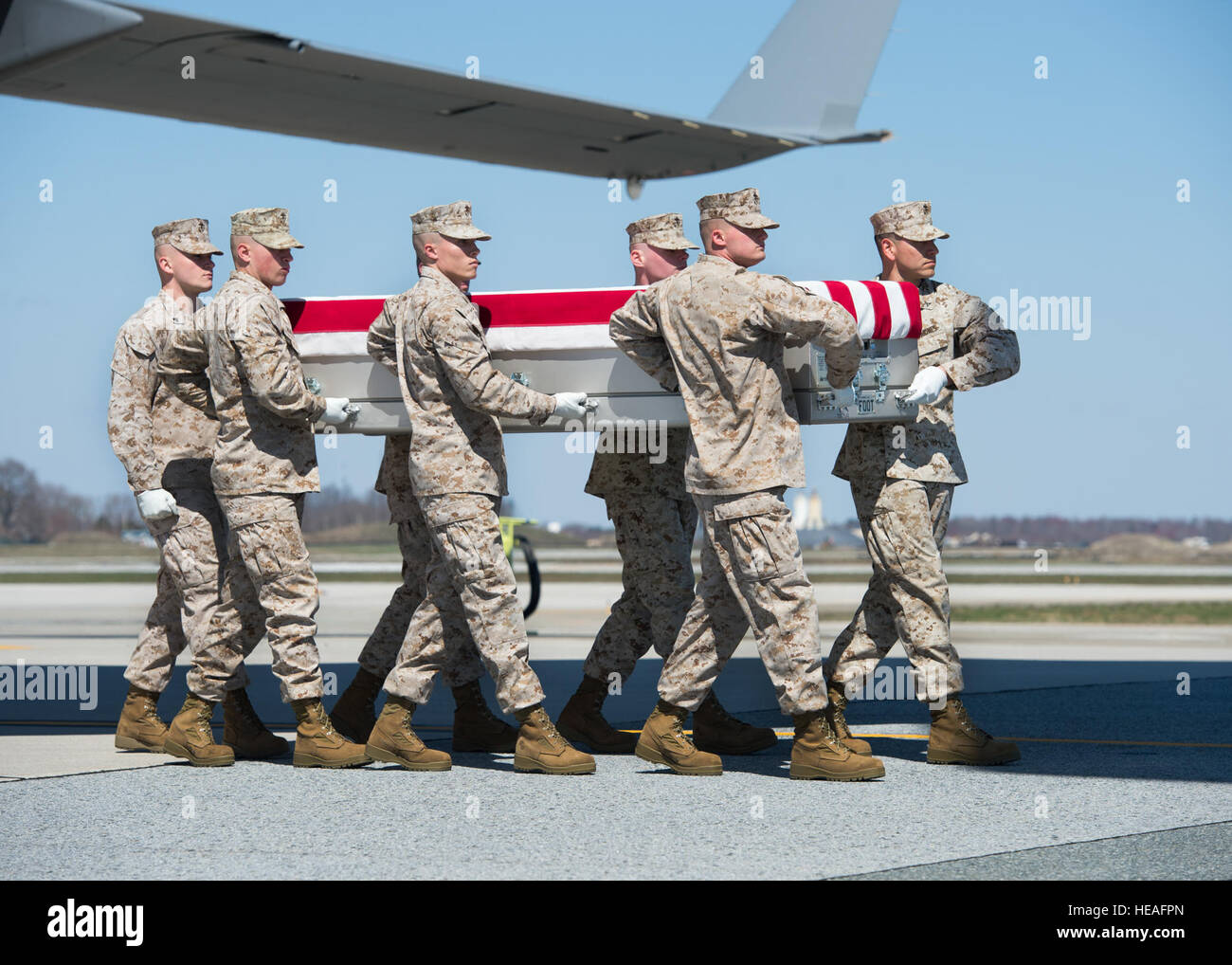 A U.S. Marine Corps carry team transfers the remains of Staff Sgt ...