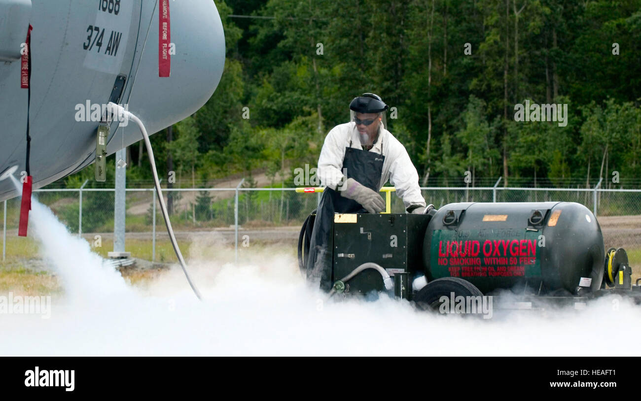 Senior Airman Sherman Roberts loads liquid oxygen into a C-130 Hercules ...