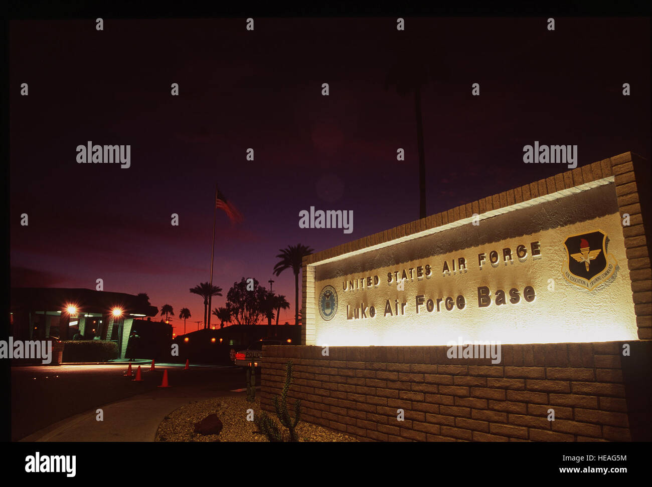 A night view of the base sign with the main gate in the background ...