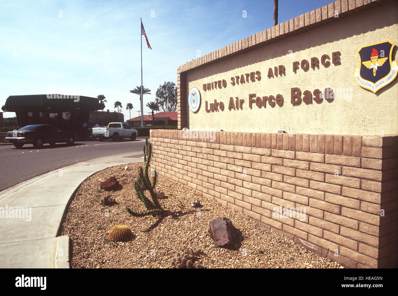 A close-up view of the base sign with the main gate in the background ...