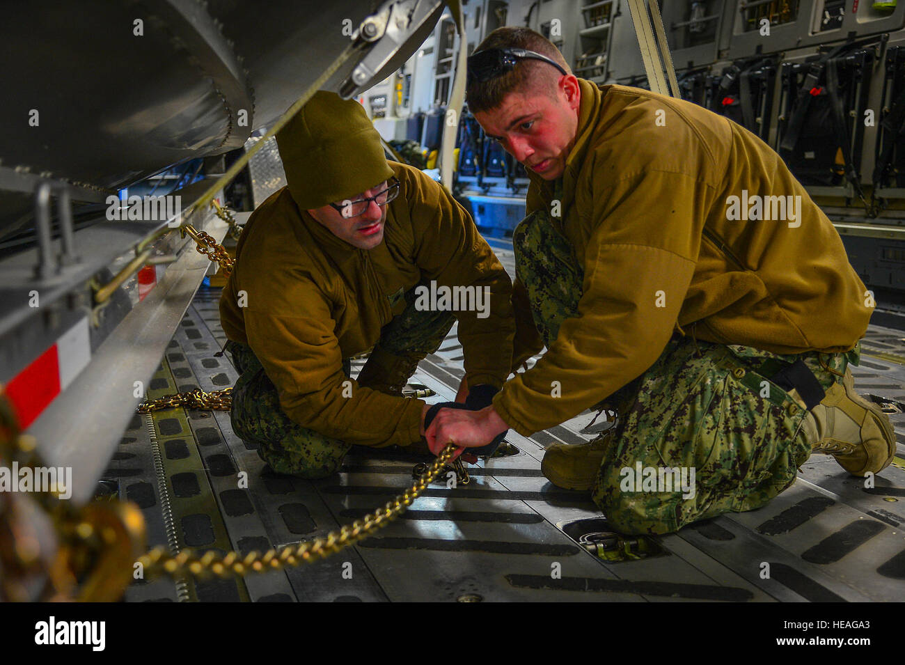 Petty Officer 2nd Class Matthew Farr (right), a machinery technician ...