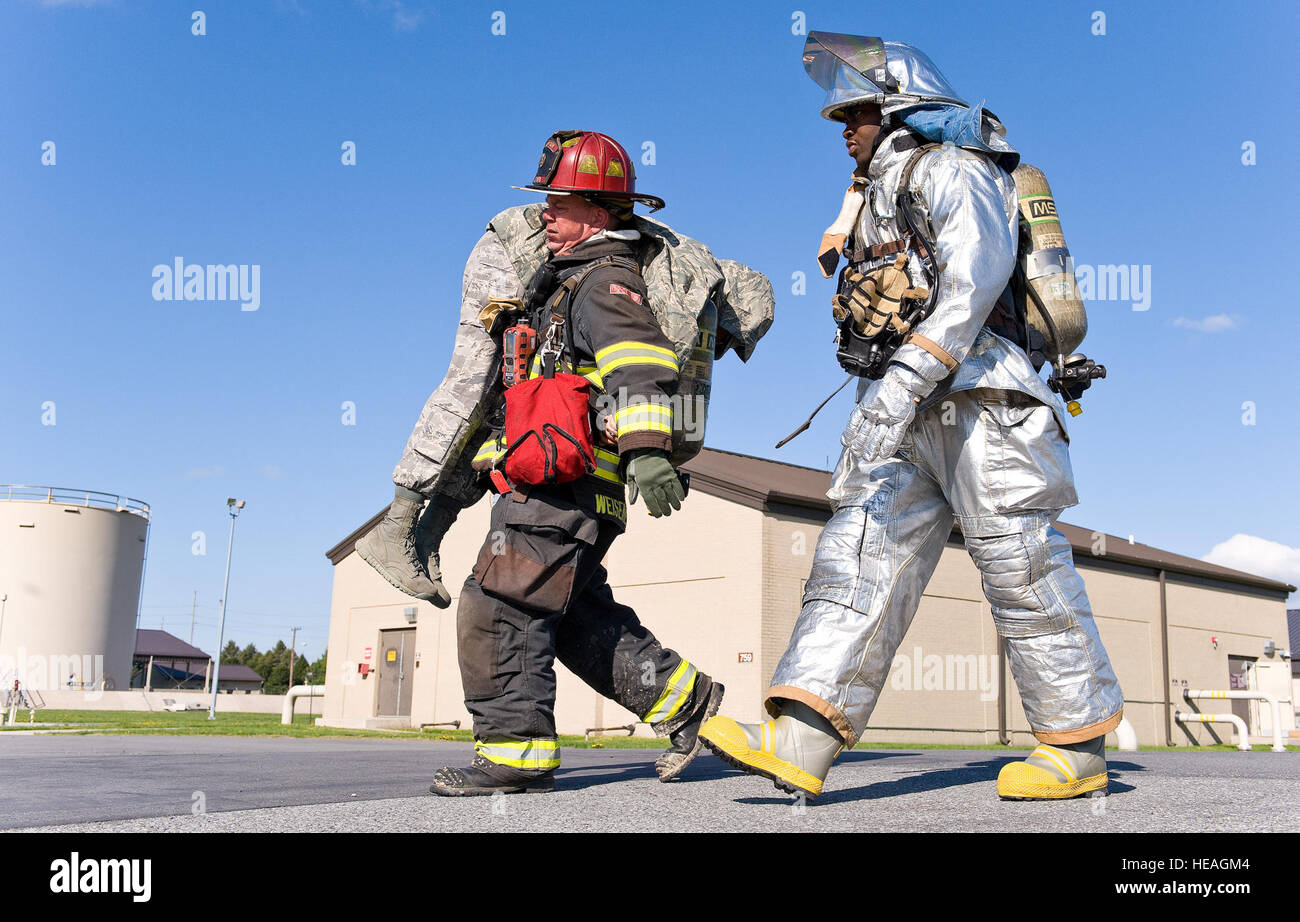 Aaron Weisenberger, right, a fire protection crew chief with the 436th ...