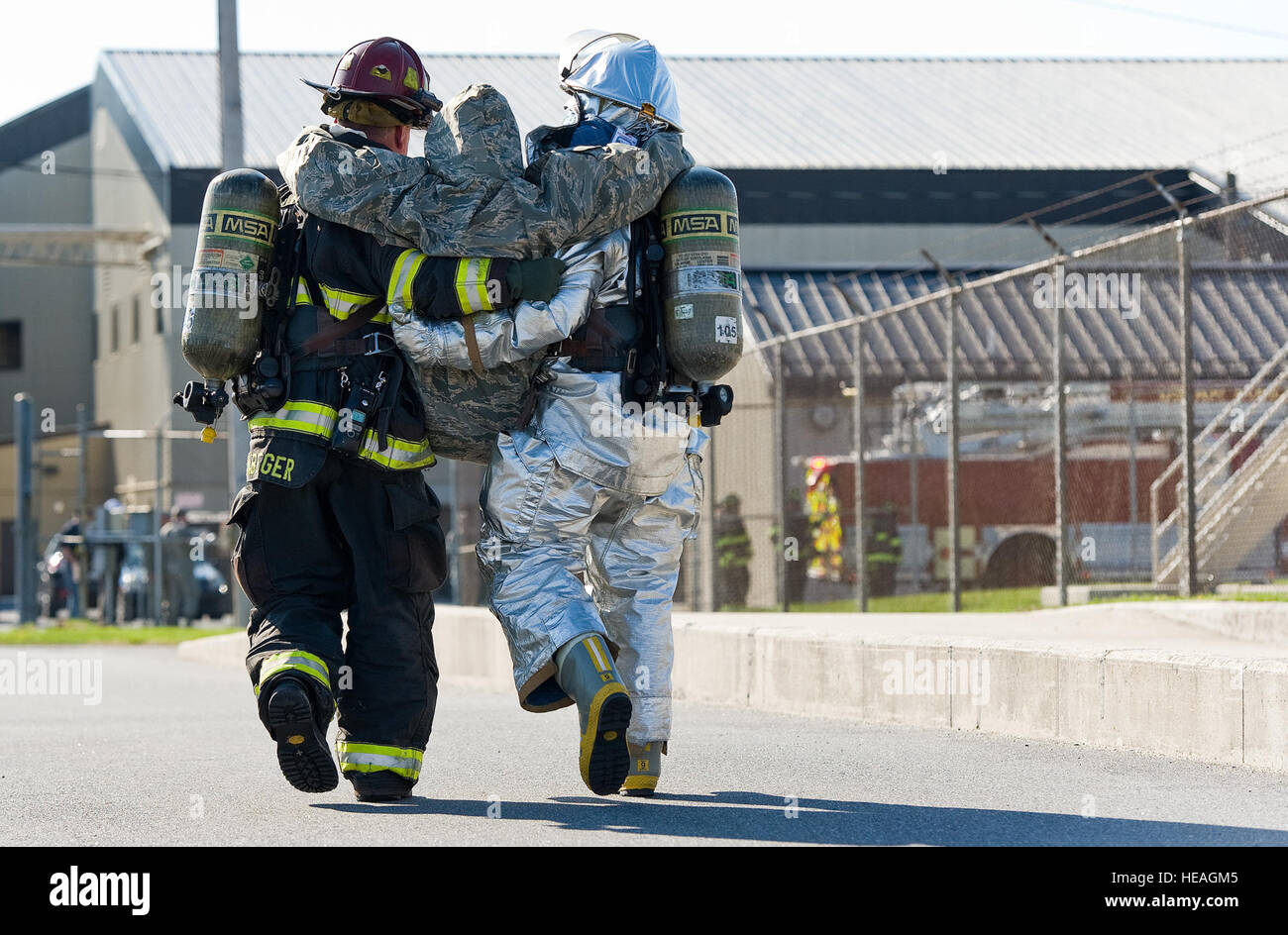 Aaron Weisenberger, left, a fire protection crew chief with the 436th ...
