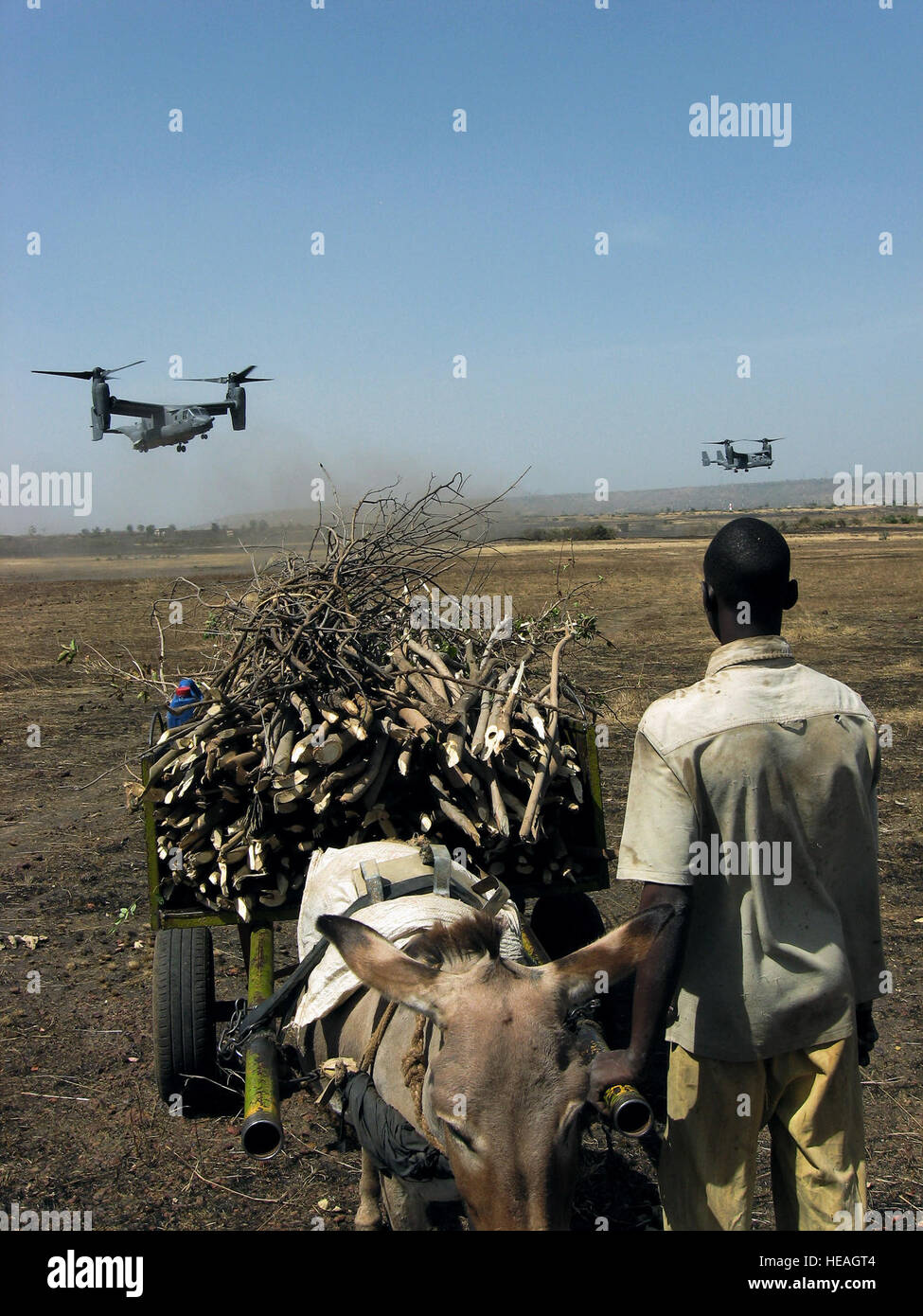 A Malian boy stops to watch incoming CV-22 Ospreys carrying Malian and ...