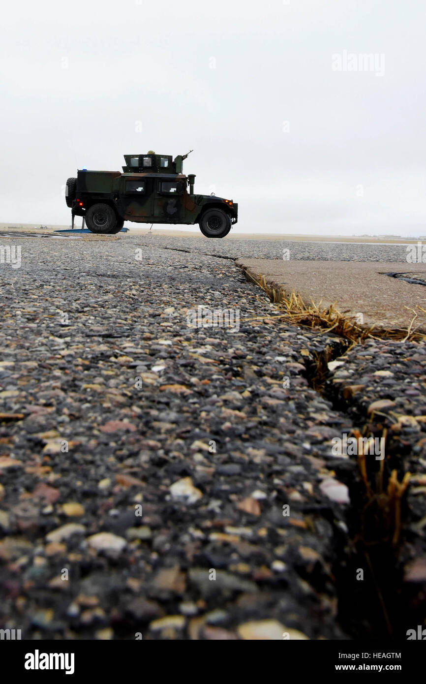 Security forces members guard a security control point during an ...