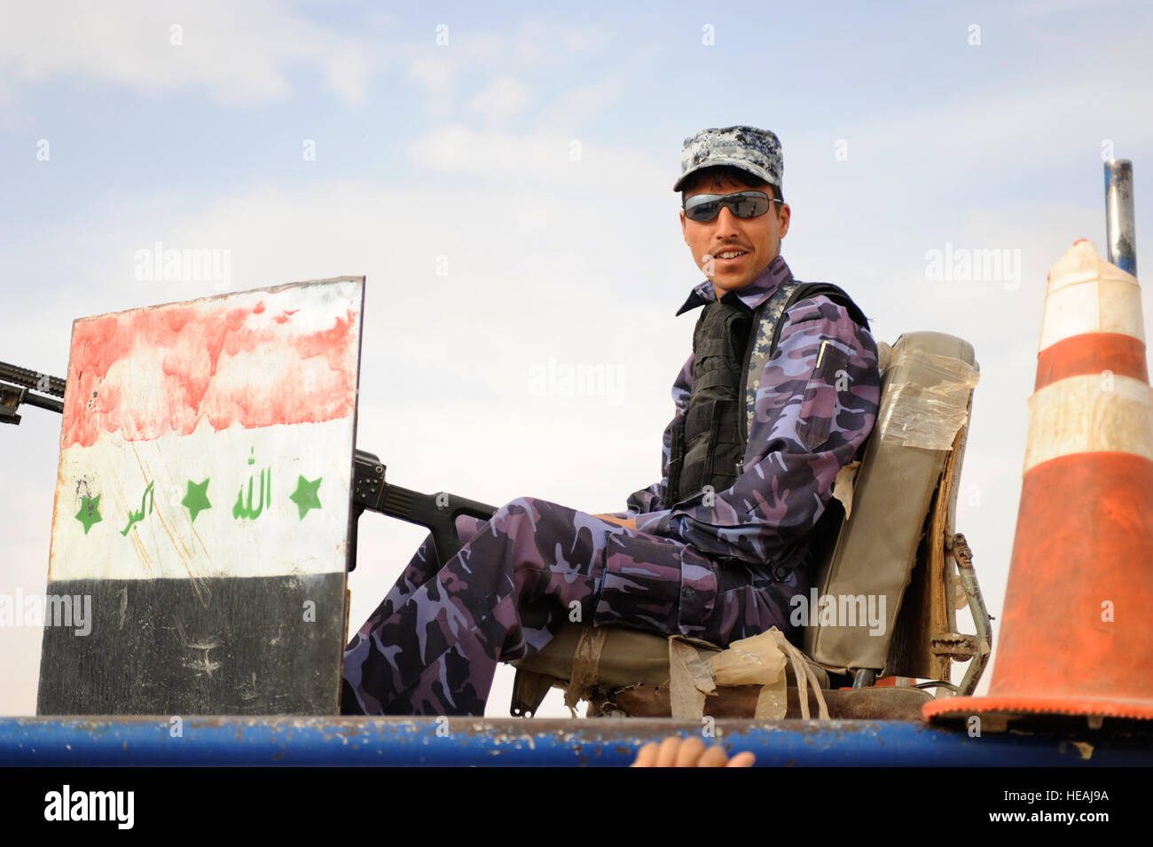 An Iraqi police officer from Al Anbar province, provides security for a ...