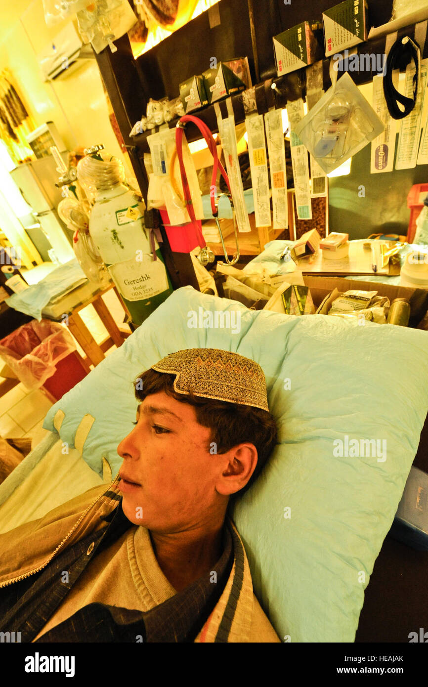 An Afghan boy waits for medical treatment at Lindenau clinic in Main ...