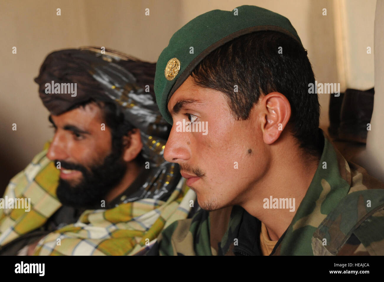 An Afghan national army soldier attends a shura in the village of ...
