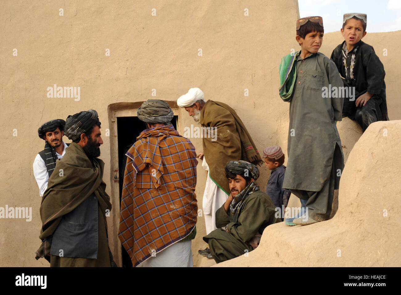 Village elders enter a meeting in the village of Shabila Kalan, Zabul ...