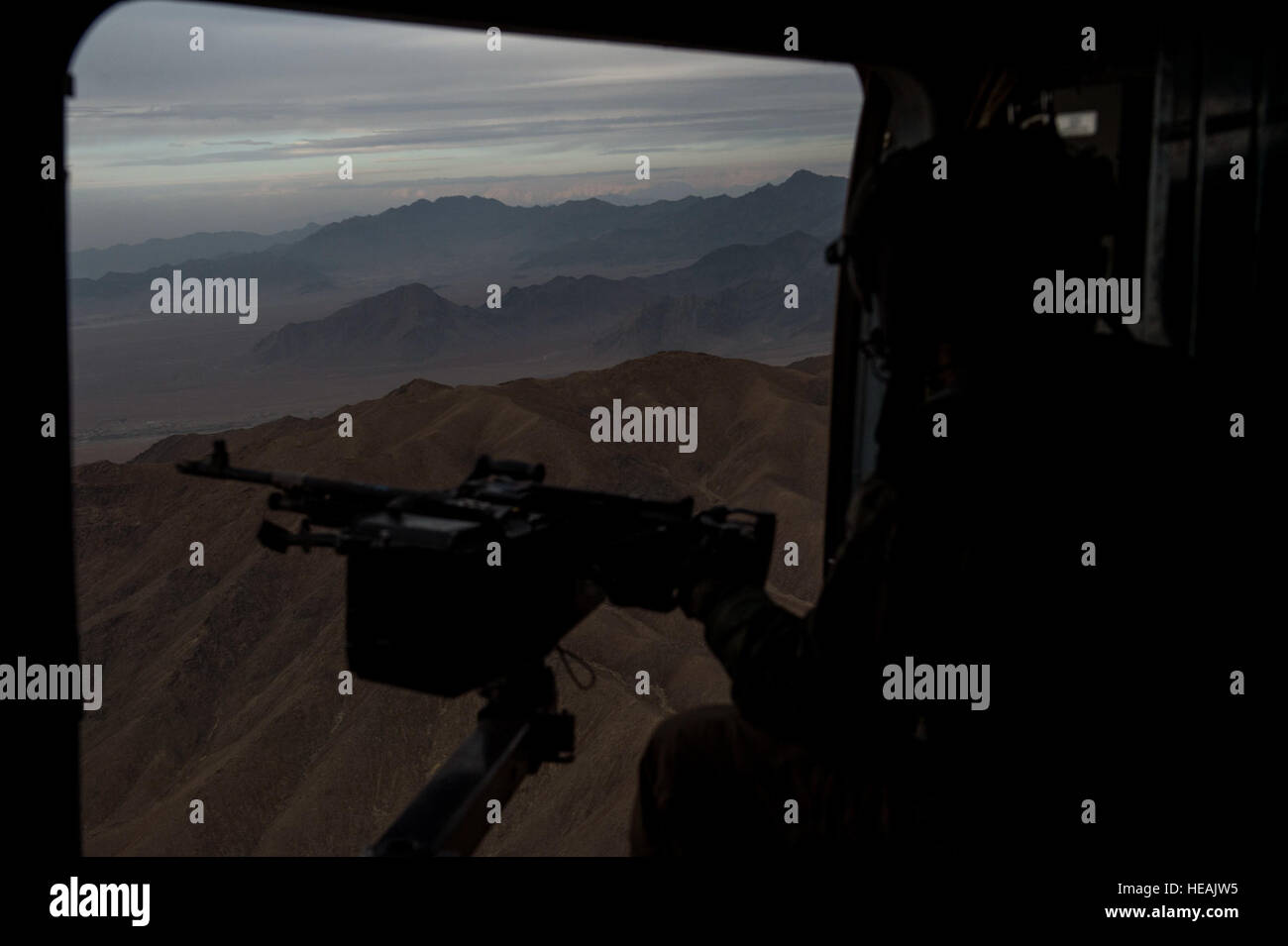 An Afghan Air Force aerial gunner flies on an Afghan Air Force Mi-17 ...