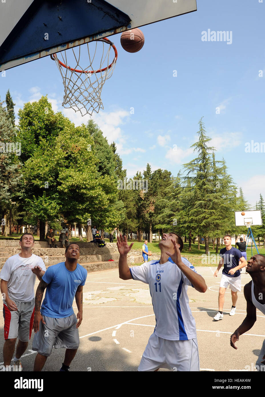 U.S. and Bosnian-Herzegovinian military members play basketball during ...