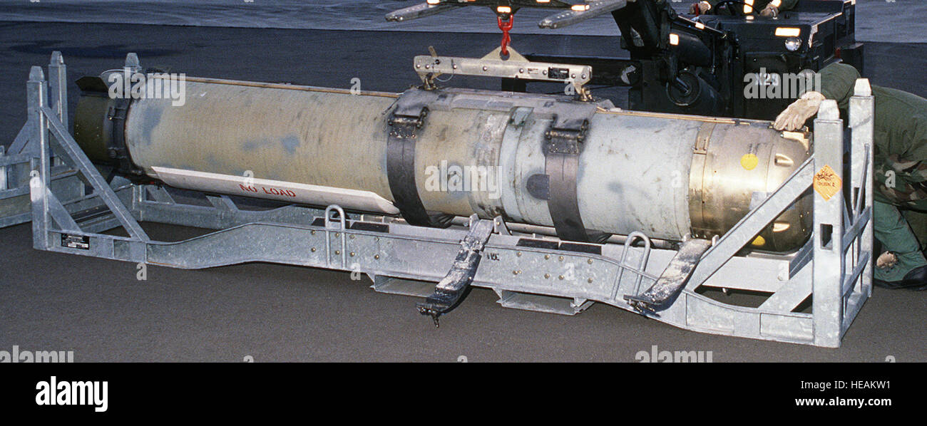 Airmen from the 42nd Munitions Maintenance Squadron prepare to load a ...