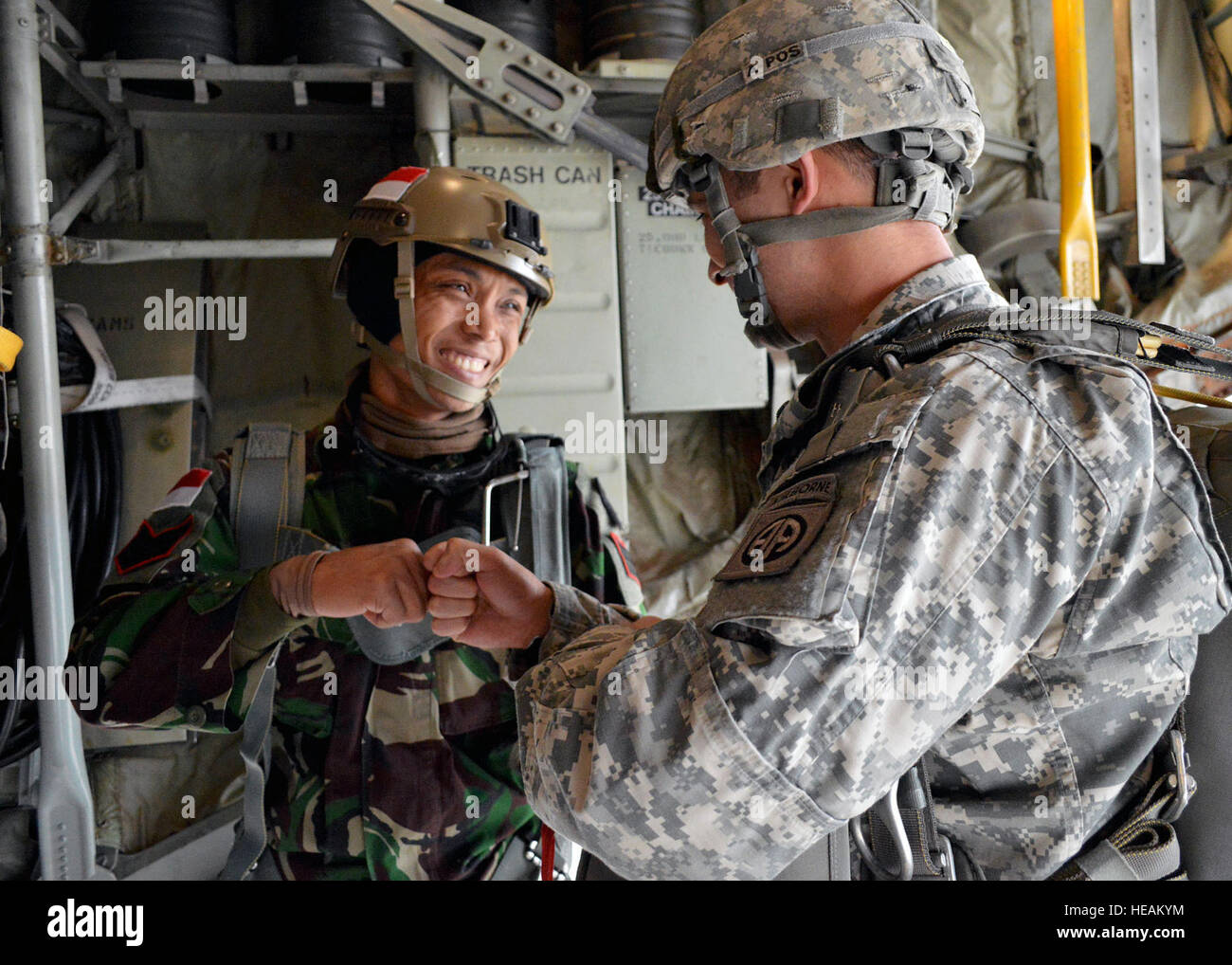 A U.S. Army Soldier from the 82nd Airborne Division fist bumps ...