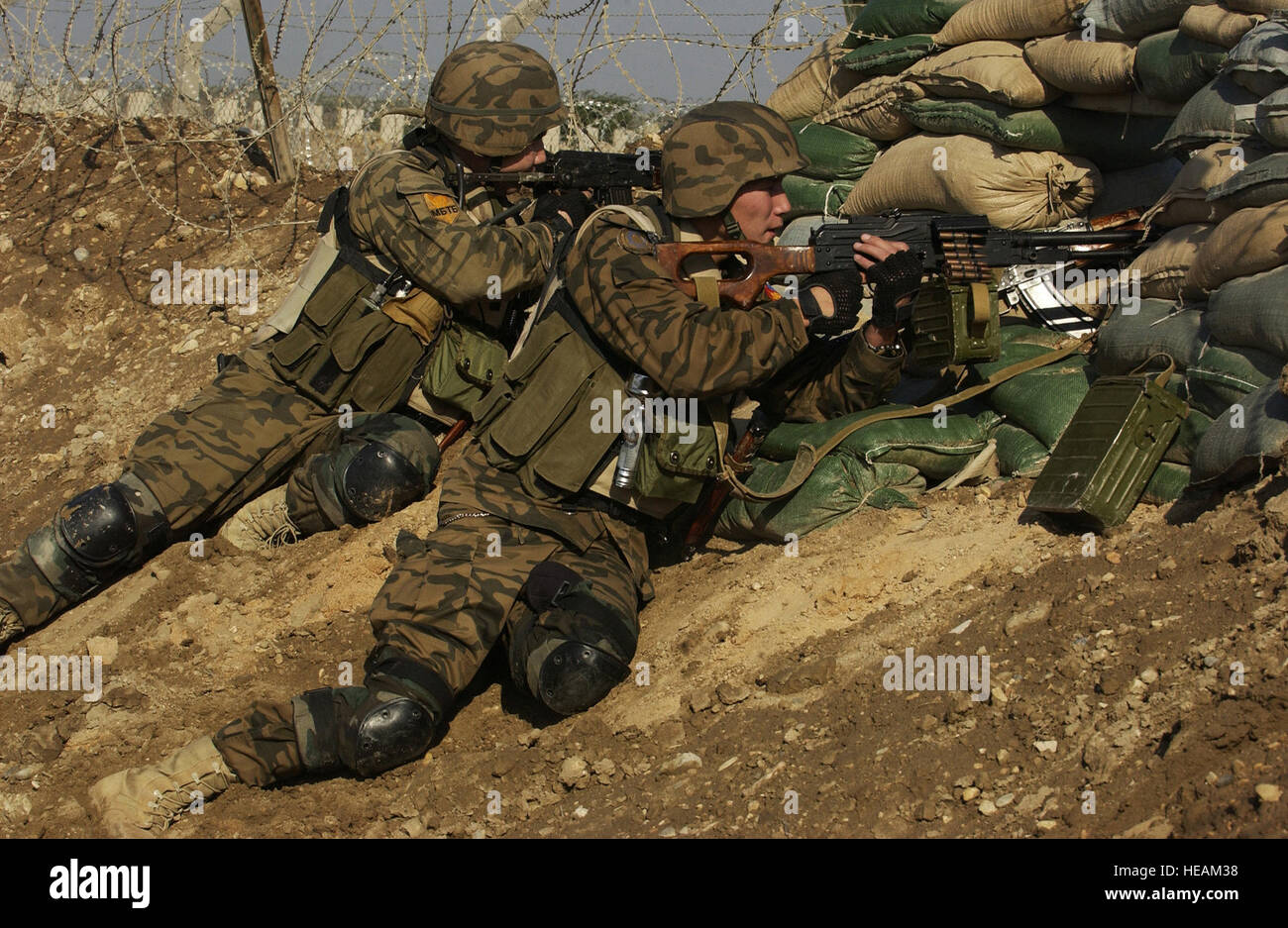 Two Mongolian Quick Reactionary Force (QRF) Army Soldiers scan the area ...