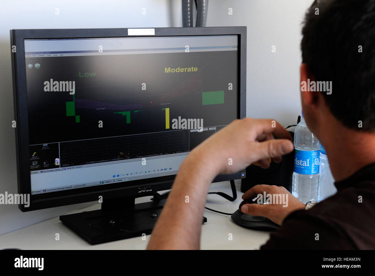 Mike Bierman, a contractor with Detect-Inc, installs a Merlin bird ...