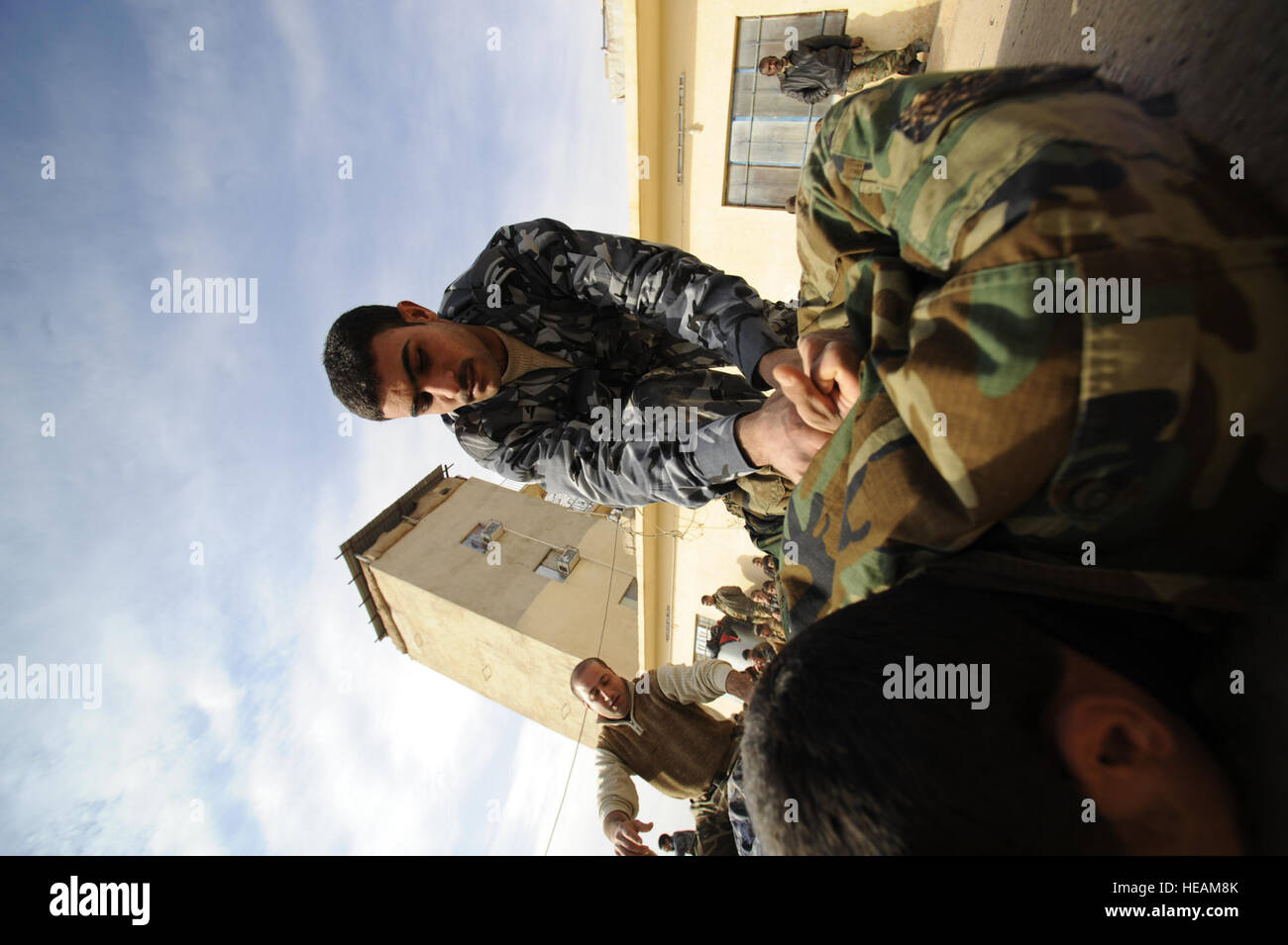 Iraqi police students practice arresting techniques during a defense ...