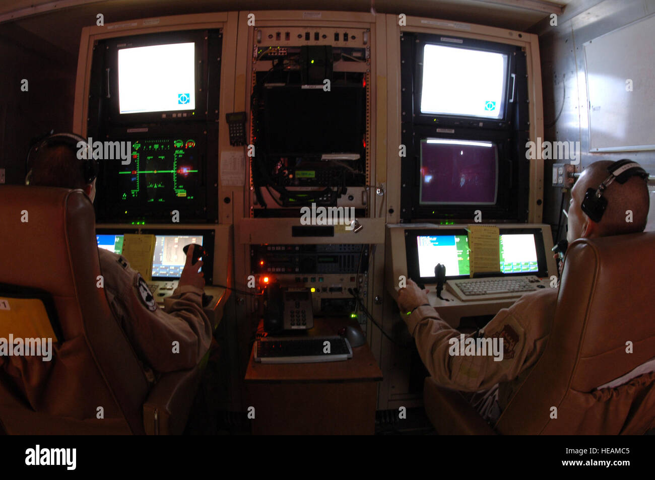 Capt. Michael Edmonston and Airman 1st Class Stephen Sadler man the ...