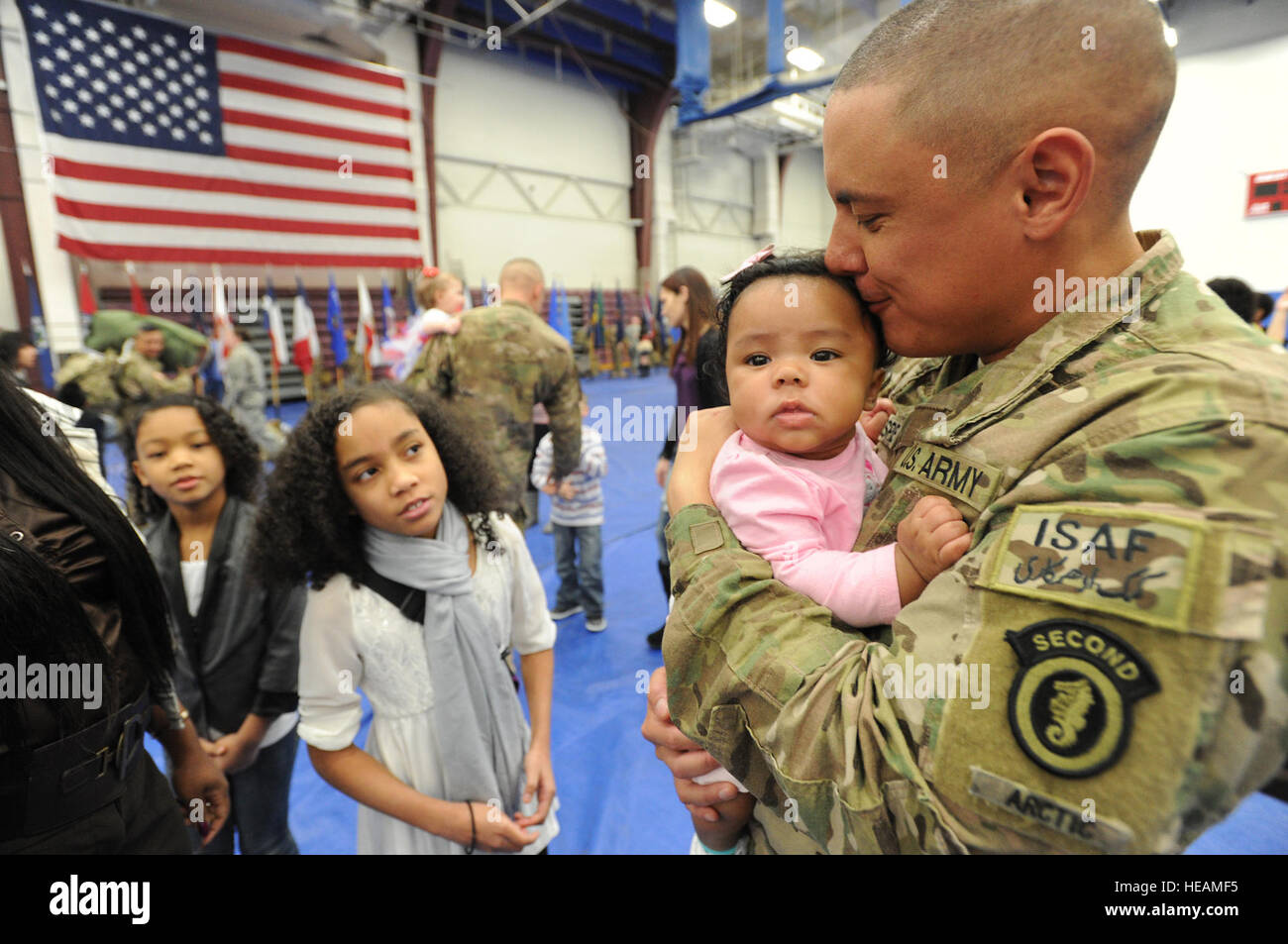 Army Sgt. Logan Gillespie, a native of Sebring, Fla., kisses his 4 ...