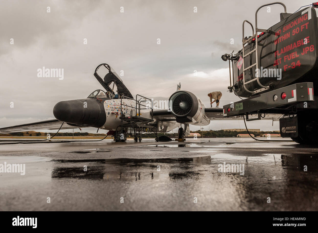 Jack Salter, a NASA WB-57F Canberra crew chief, refuels the aircraft ...