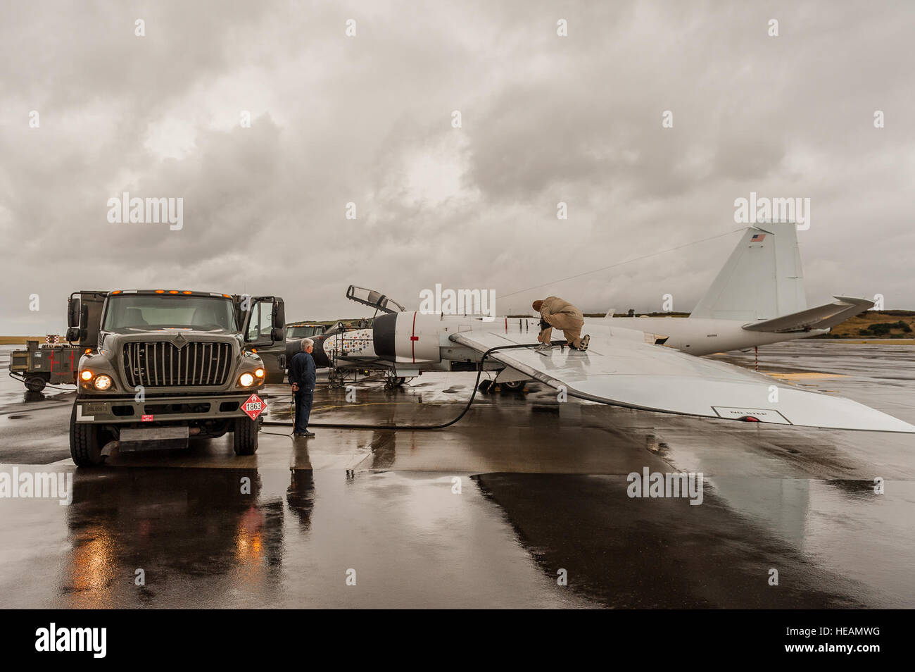 NASA's WB-57F Canberra crew chief, Jack Salter, refuels the aircraft ...