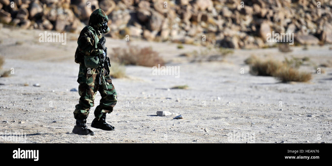 A U.S. Army FIRES team member operates in MOPP level 4 during a ...