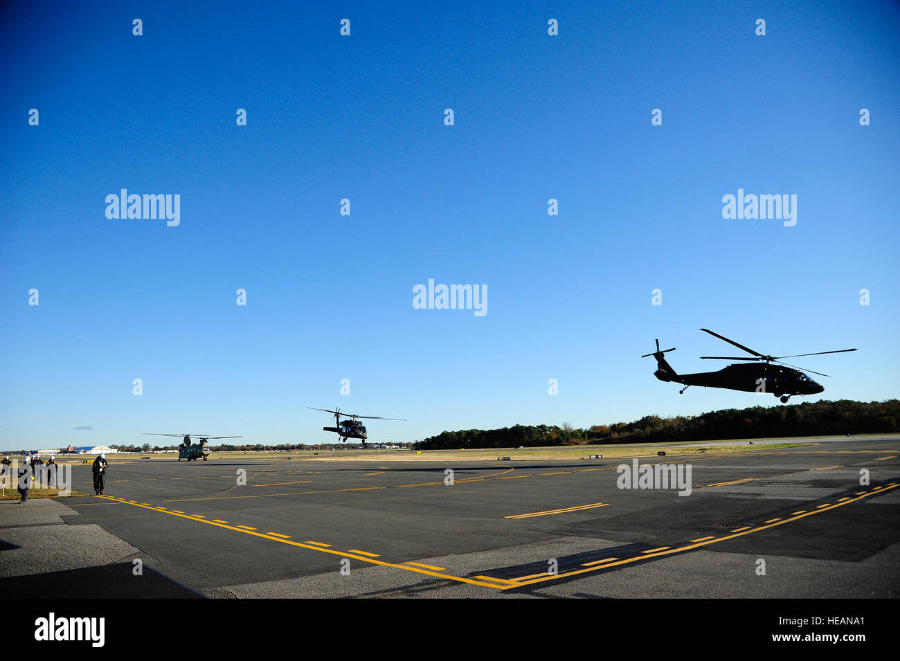 Two UH-60 Black Hawk helicopters and a CH-47 Chinook lift off after ...
