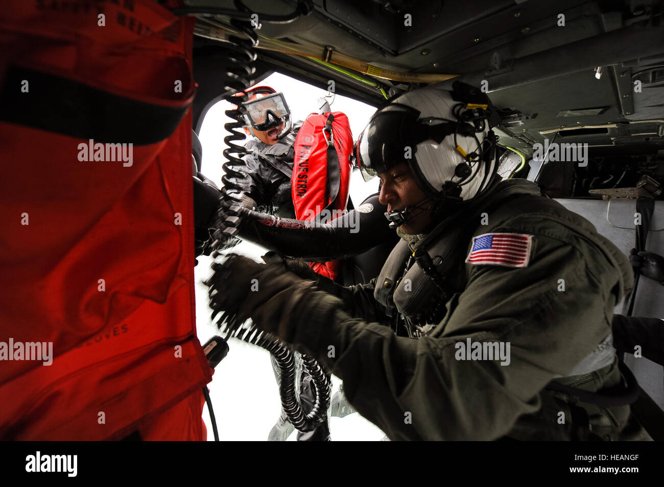 U.S. Navy Petty Officer 1st Class Charles Benjamin (right), Helicopter ...