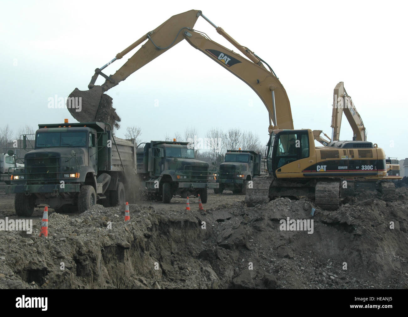 North Dakota Army National Guard uses dump trucks to transport clay for ...