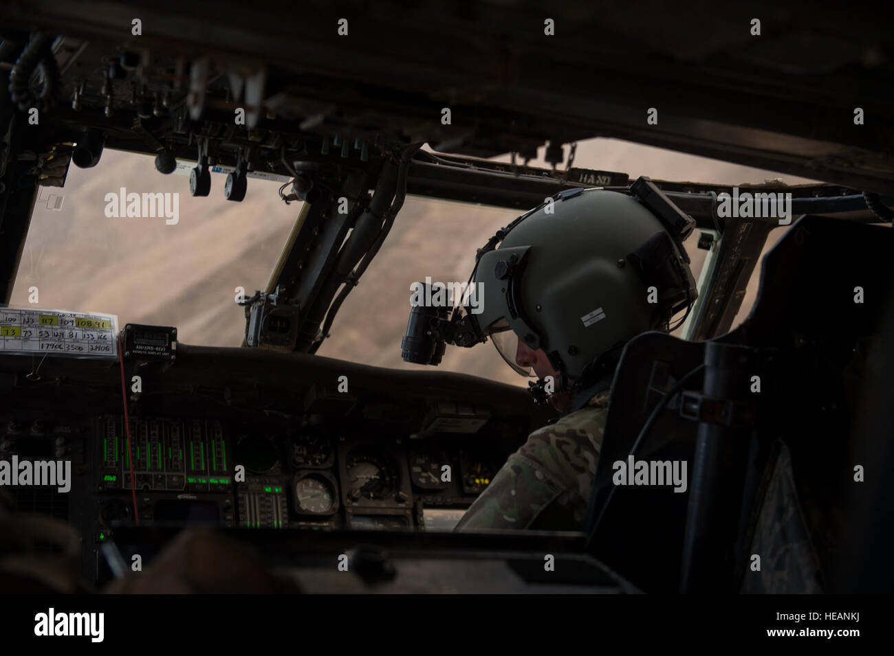 A pilot from the 303rd Expeditionary Rescue Squadron checks the ...